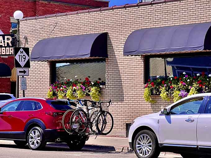 Flower boxes and bikes suggesting a lifestyle where people actually have time to enjoy simple pleasures daily.