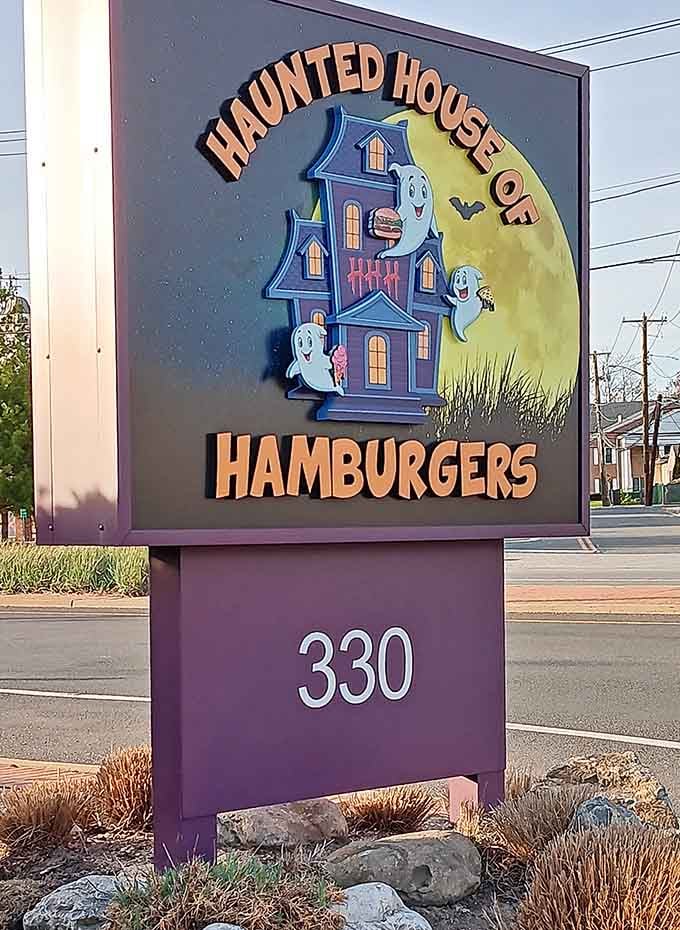 The cheerful ghost-adorned sign welcomes visitors to 330, where hamburgers and hauntings coexist in perfect Long Island harmony.