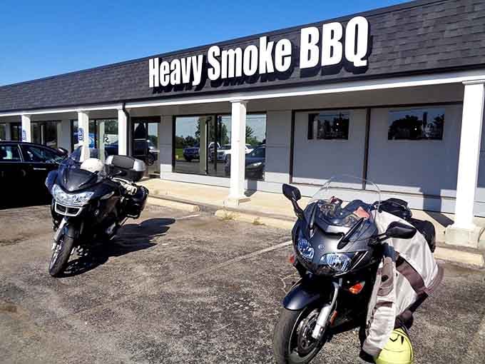 Even the motorcycles know where to find the good stuff, parked and ready for some championship barbecue fuel.