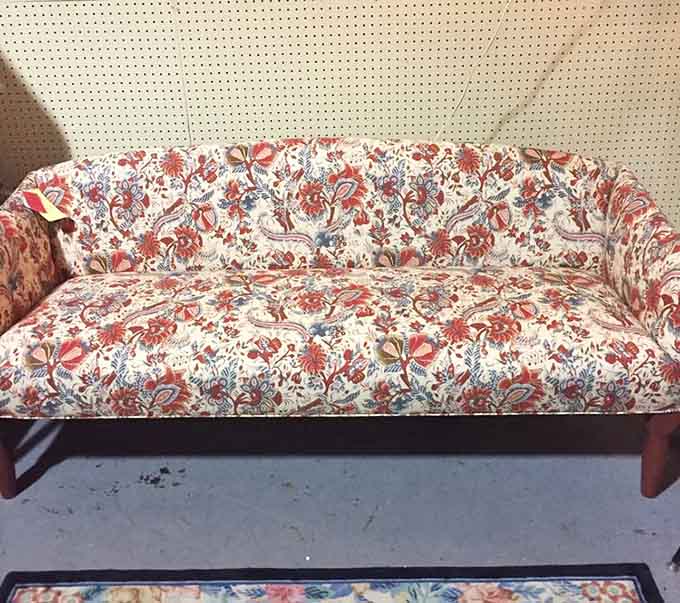 Floral upholstered couch that's equal parts grandma's house and trendy bohemian chic design statement.