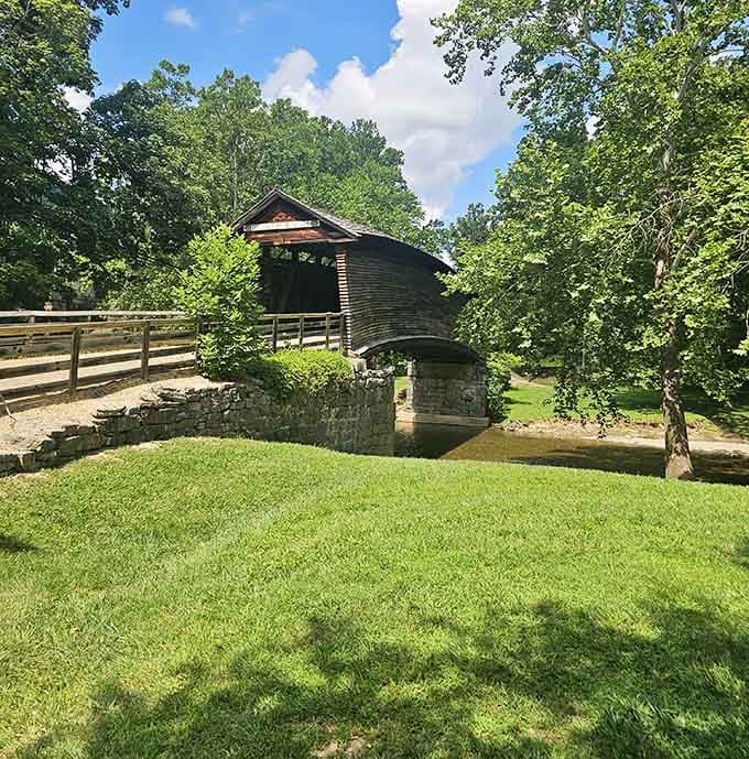 Lush summer greenery surrounds the bridge like it's been there forever, because it basically has been there forever.