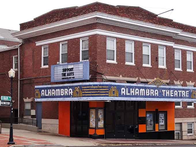 The Alhambra Theatre's vintage marquee proves small towns still cherish live entertainment and community gathering spots worth preserving.