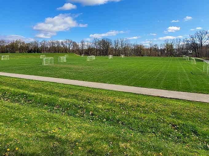 Emerald green soccer fields stretching toward the horizon under blue skies look like heaven for any sports-loving family.
