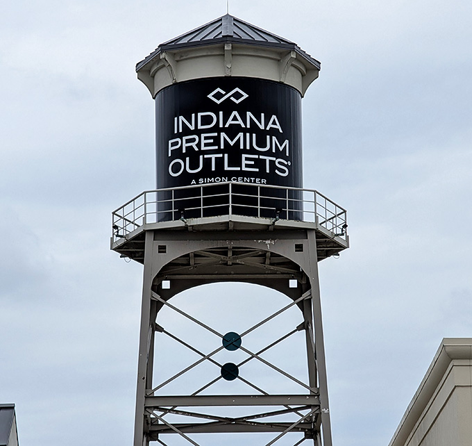 That water tower stands tall like a lighthouse guiding bargain hunters safely to their discount shopping destination