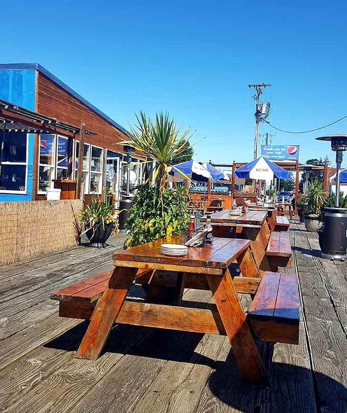 Outdoor seating with marina views means you can watch boats while contemplating your next round of crab.