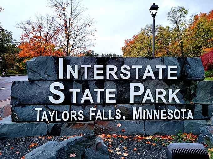 The entrance sign stands proud against autumn colors, marking the gateway to Minnesota's geological treasure chest.