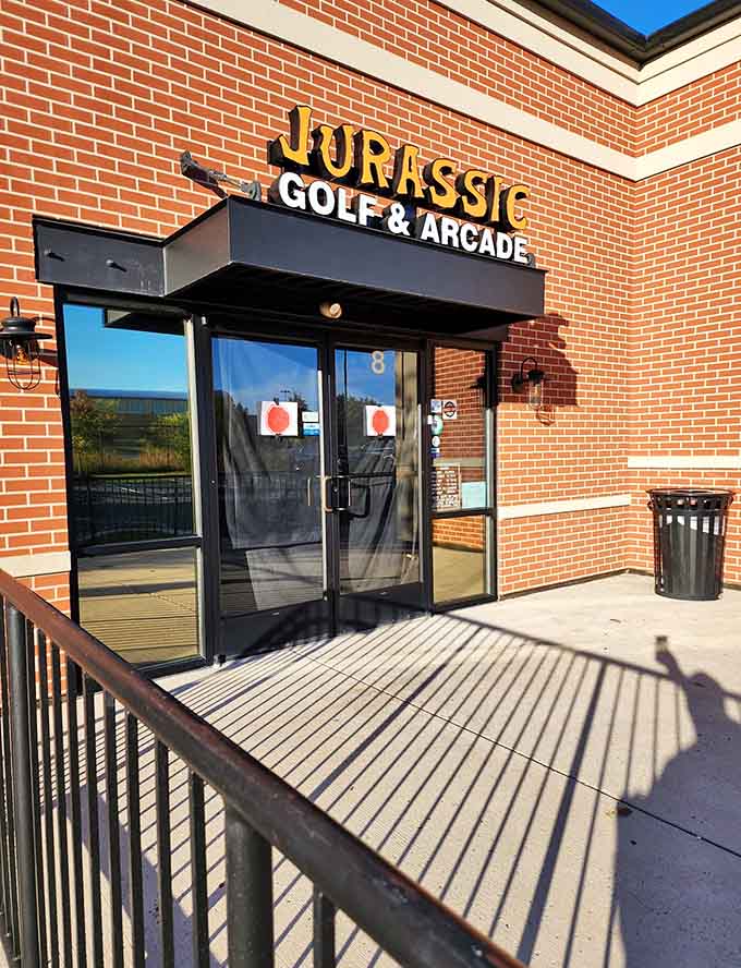 Sunshine illuminates the entrance by day, revealing how this unassuming storefront hides such extraordinary adventures within its brick walls.