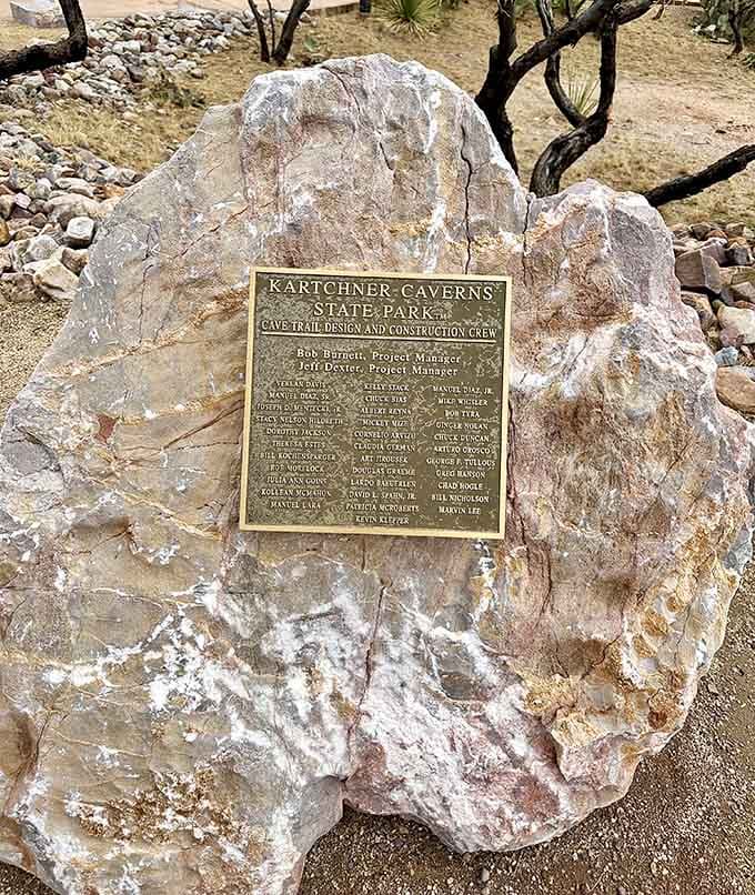 This plaque honors the construction crew who built pathways through paradise without disturbing a single formation.