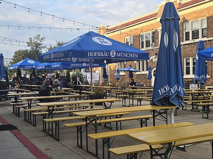 Outdoor seating under Hofbr&auml;u umbrellas because sometimes your fish fry needs fresh air and sunshine too.