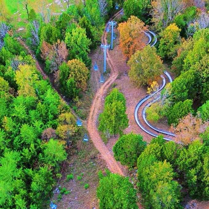 From above, the slides look like silver ribbons draped across the landscape, inviting you to come play.
