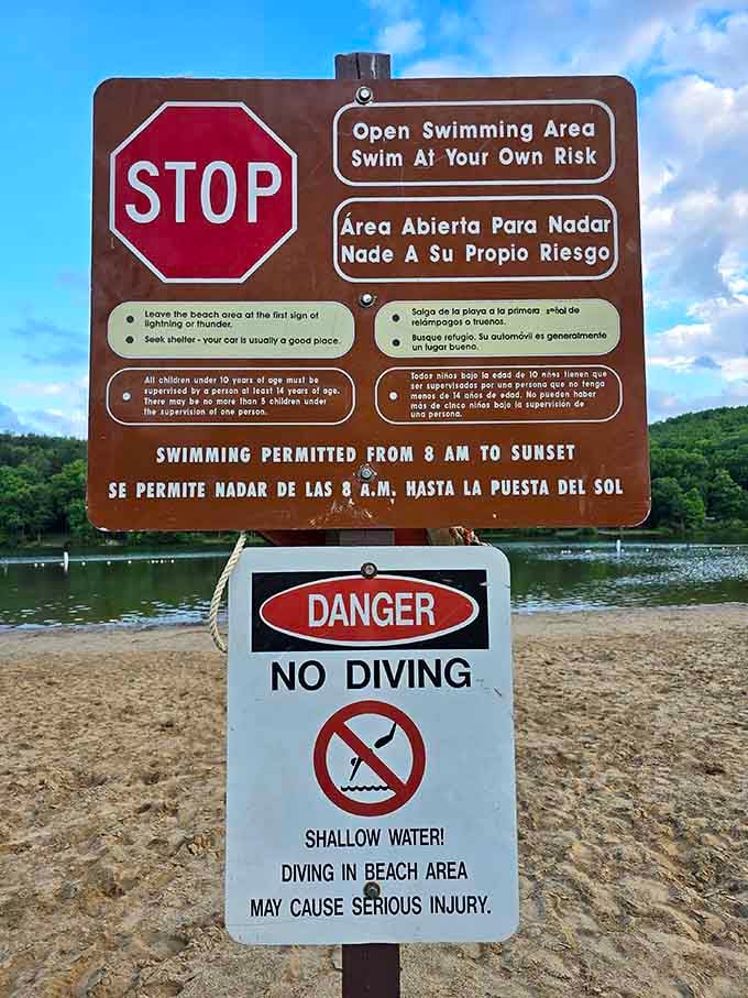 Swimming hours clearly posted because safety matters, even when you're having the time of your life in shallow waters.