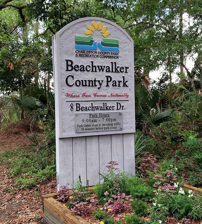 The official welcome sign with its cheerful motto perfectly captures the laid-back vibe waiting just beyond those trees.