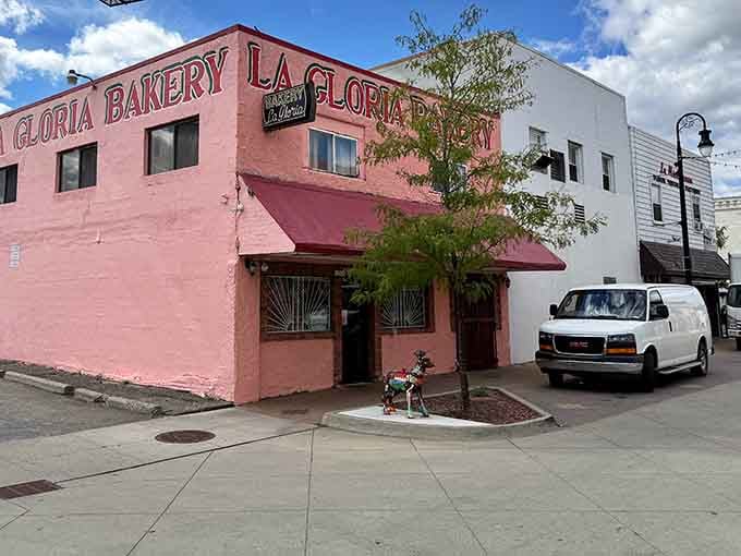 From the outside, that pink corner building quietly tells the whole neighborhood, something worth stopping for is right here.