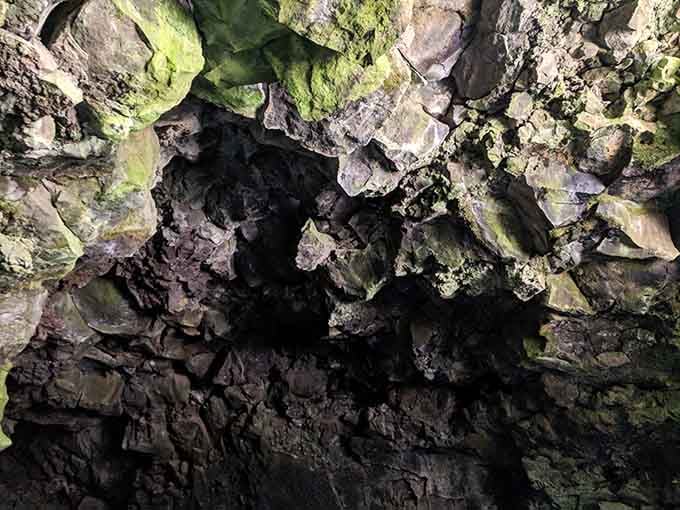The cave ceiling displays nature's abstract art, with colors and textures that no human artist could ever replicate.
