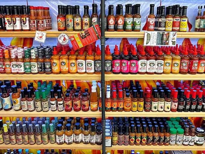 Hot sauce bottles create a spicy rainbow, offering heat levels from "pleasant tingle" to "call the fire department."