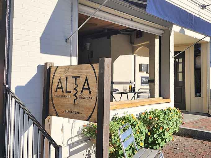 Alta's wine bar entrance beckons with Mediterranean promises and the kind of atmosphere that encourages lingering.