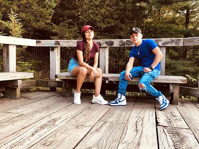 Two visitors soaking in the view from the overlook bench, living their best Illinois life right now.