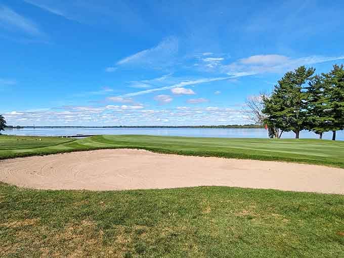 Sand traps frame emerald fairways meeting endless blue water, creating postcard views you can actually afford to enjoy.