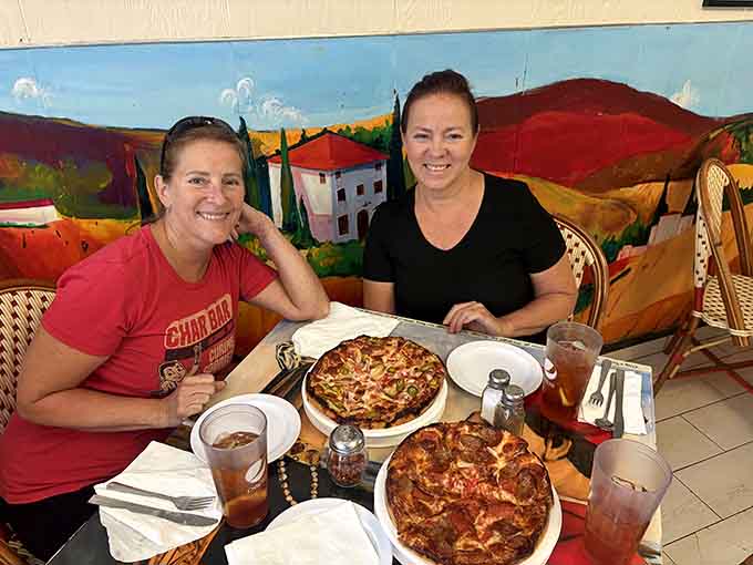 Happy faces, great pizza, and colorful murals create the trifecta of a perfect meal shared with good company.