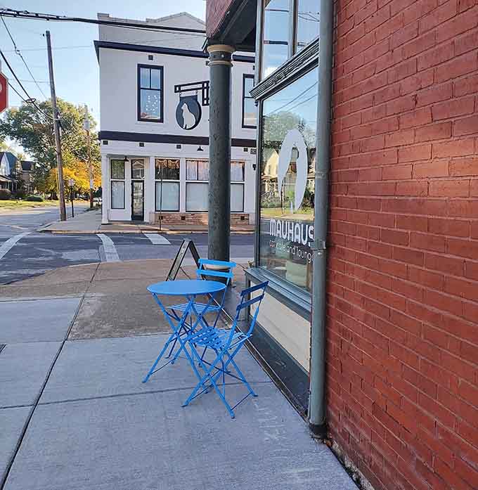 Blue bistro chairs on the sidewalk invite you to enjoy your coffee outside before heading in for the main event.