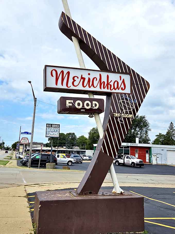 That iconic sign stands tall like a lighthouse guiding ships, except it's guiding hungry people to incredible food.