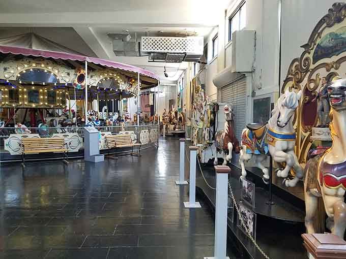 Gallery halls filled with carousel creatures standing guard like the world's most cheerful museum security team ever.