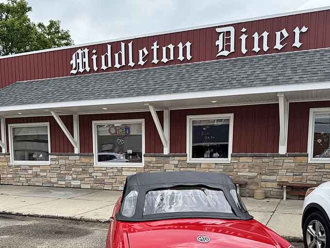 Even the parking lot view looks inviting, with that classic red convertible adding a touch of Americana charm.