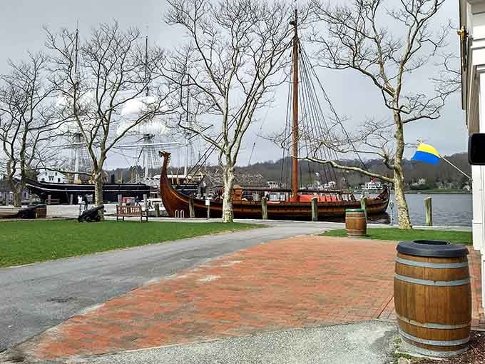 A perfect photo spot showcasing the museum's recreated village and historic vessels along the peaceful Mystic River.