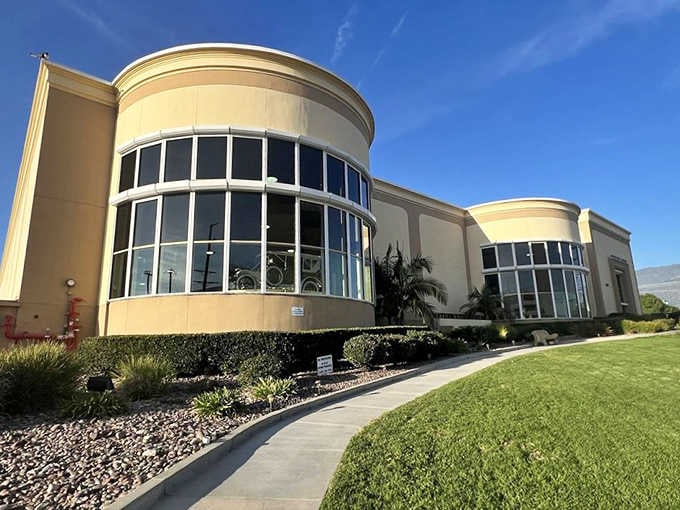 The museum's exterior architecture hints at the treasures within, like a jewelry box that happens to hold vintage automobiles instead.