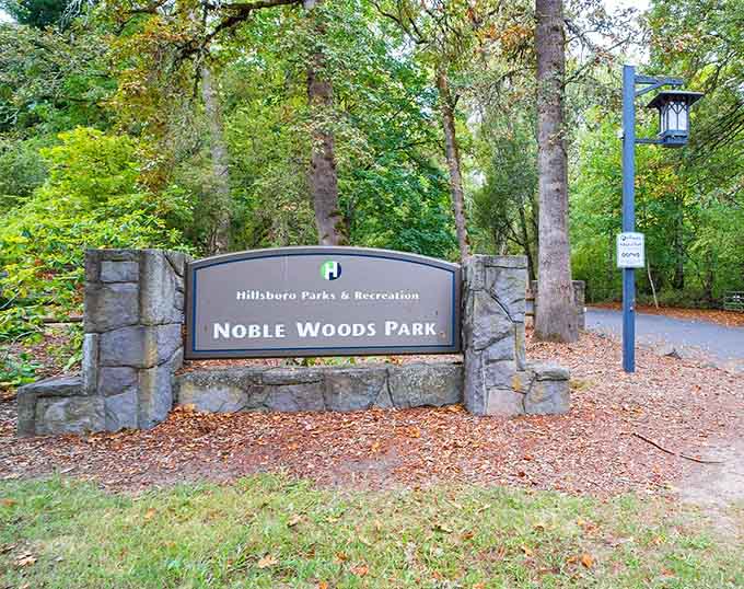 Noble Woods Park welcomes you with stone pillars and autumn leaves, like a friendly handshake from the Pacific Northwest itself.