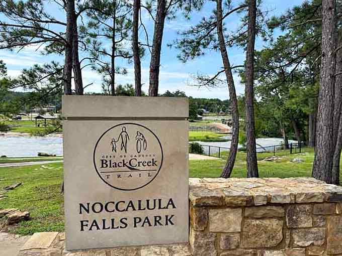 The welcome sign marks the beginning of your adventure, where parking is easy and waterfalls are spectacular.