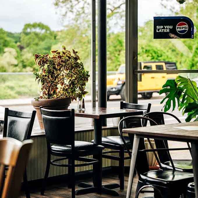 Cozy seating with plants and personality, the kind of spot where you linger longer than you planned.