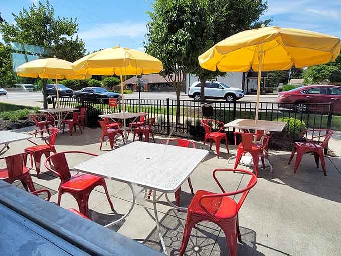 Outdoor seating under sunny umbrellas turns a regular Tuesday morning into a mini vacation without the airport hassle.