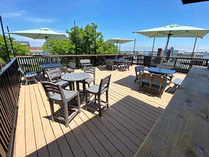 The rooftop deck offers fresh air and harbor views, ideal for recovering from your devastating pinball defeat with dignity.