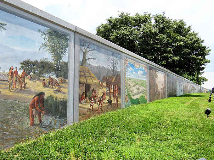 These floodwall panels transform functional infrastructure into an outdoor gallery celebrating regional heritage beautifully.