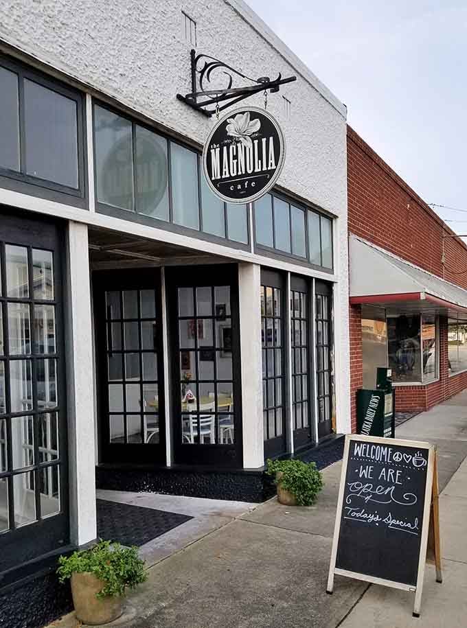 The Magnolia Cafe's welcoming entrance promises the kind of dining experience where you're treated like family immediately.