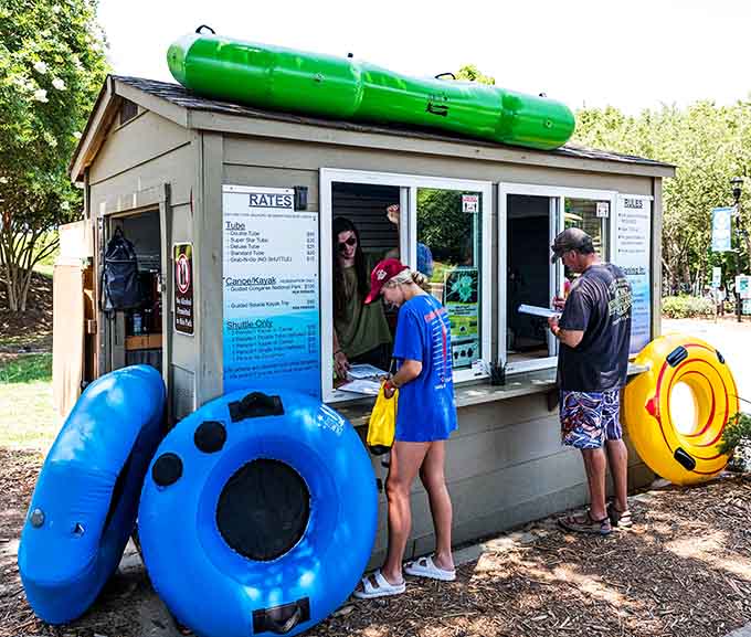 The rental booth where your river dreams become reality, complete with tubes perched on top like a beacon.