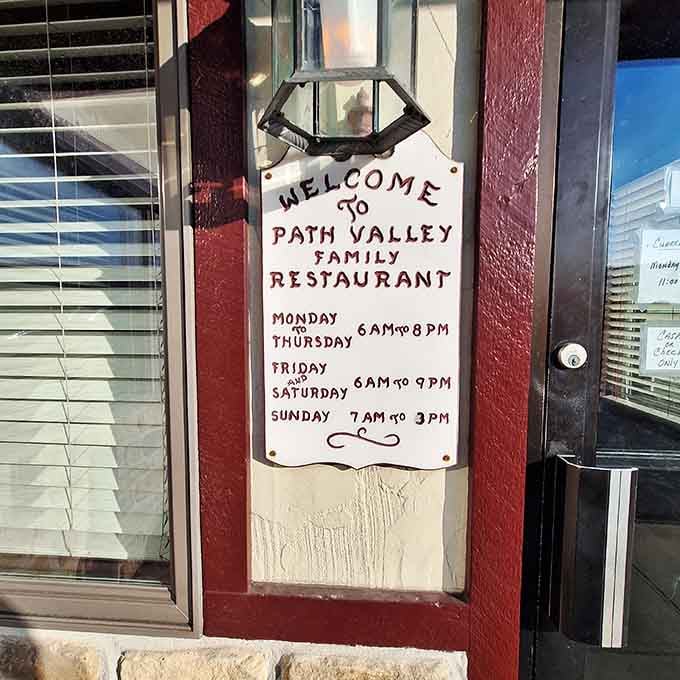 Handwritten hours on the door, because when you don't have a website, you improvise with what actually works.