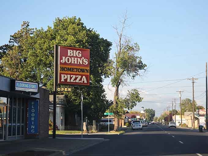 Big John's pizza sign beckons like a beacon for anyone who believes good food doesn't require fancy surroundings.