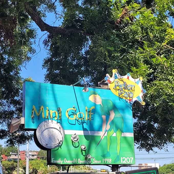The vintage sign welcomes you to a place where growing up is optional and hole-in-ones are always celebrated properly.