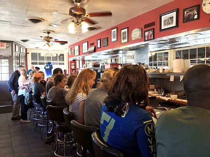 Full house at Pete's where strangers become friends over coffee, united by their excellent breakfast choices.