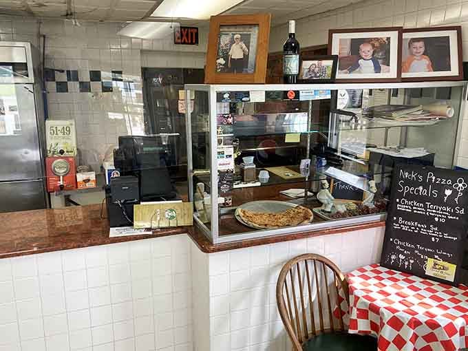 Nick's Pizzeria serves up pies in a cozy space where family photos outnumber corporate branding posters every single time.