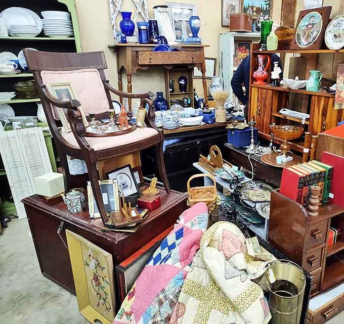 Every surface tells a different story here, from vintage linens to blue glassware that catches light like pure magic.
