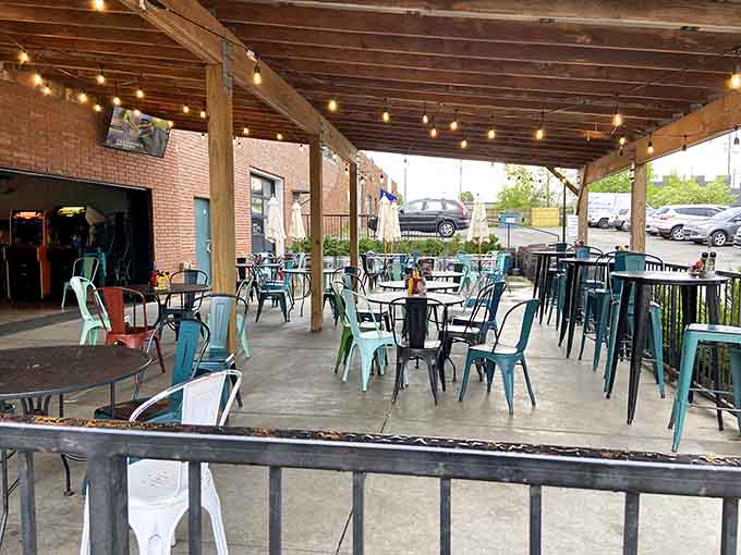 Outdoor seating under string lights means you can catch your breath between gaming sessions while pretending you're not completely exhausted.