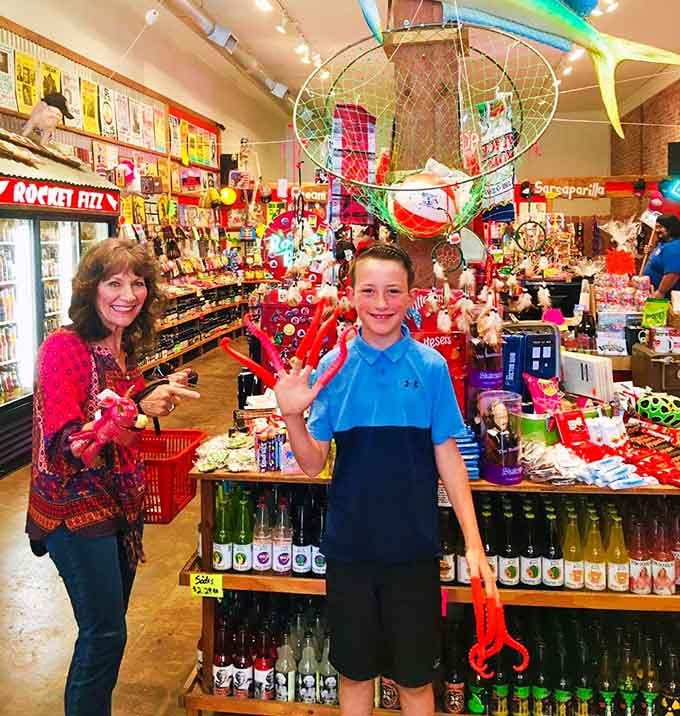 Happy customers clutching their fizzy finds, proof that joy comes in bottles and bags at any age.