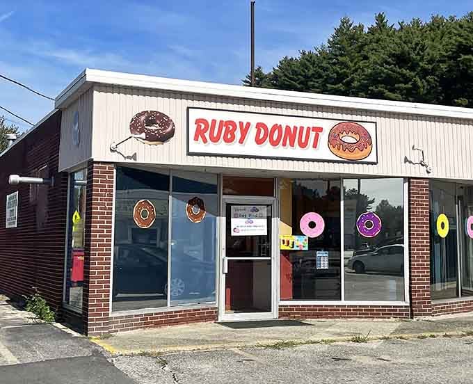 The storefront decorated with colorful donut cutouts, making sure nobody drives past without noticing this sweet spot.