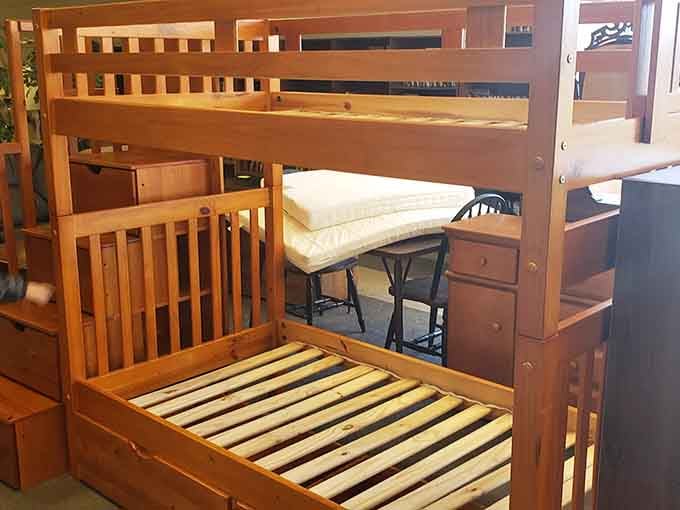 This sturdy bunk bed with built-in storage solves space problems better than any expensive furniture showroom ever could.