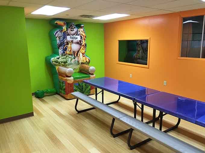 Party rooms feature safari murals and long tables, ready to host celebrations where cake is mandatory and naps follow.