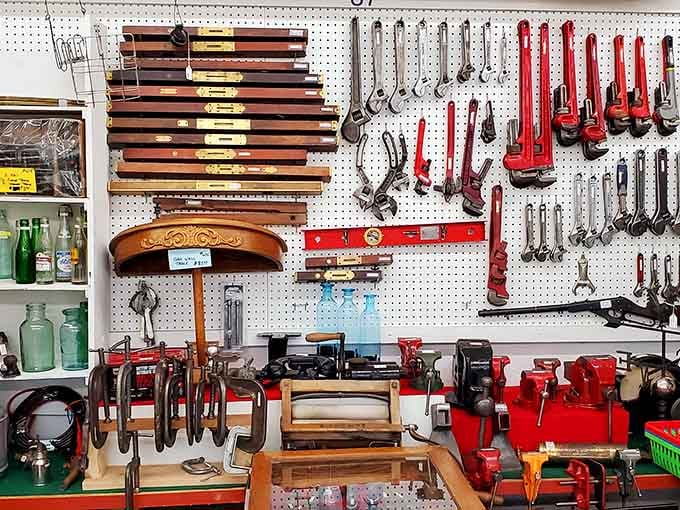 Vintage tools hang organized on pegboard, ready for craftspeople who appreciate quality over disposable modern alternatives.