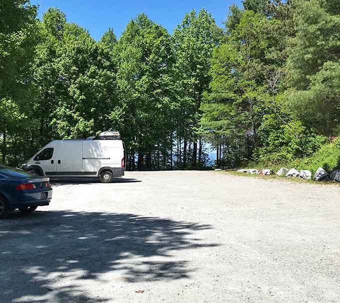 The parking area where your mountain summit adventure begins and ends&mdash;civilization meets elevation with remarkable convenience.